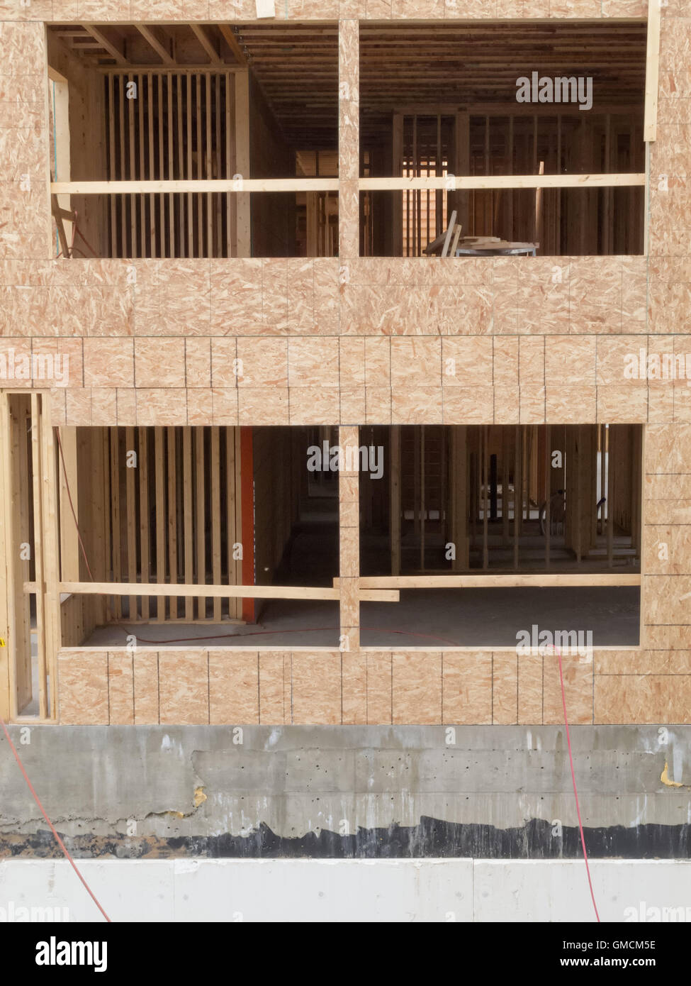 Construction of new building empty window openings Stock Photo - Alamy