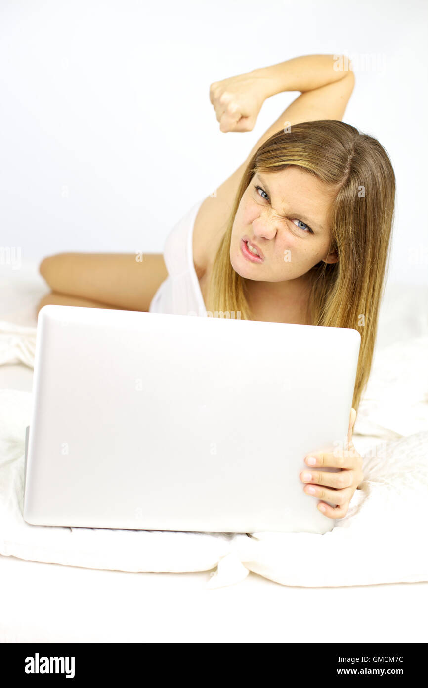 Beautiful woman ready to punch technology Stock Photo - Alamy