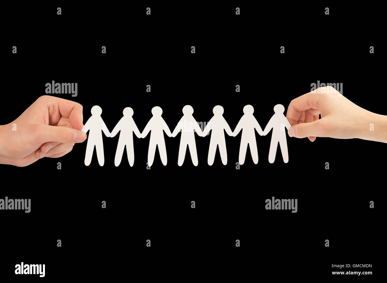 paper people in hands(man and woman Stock Photo - Alamy