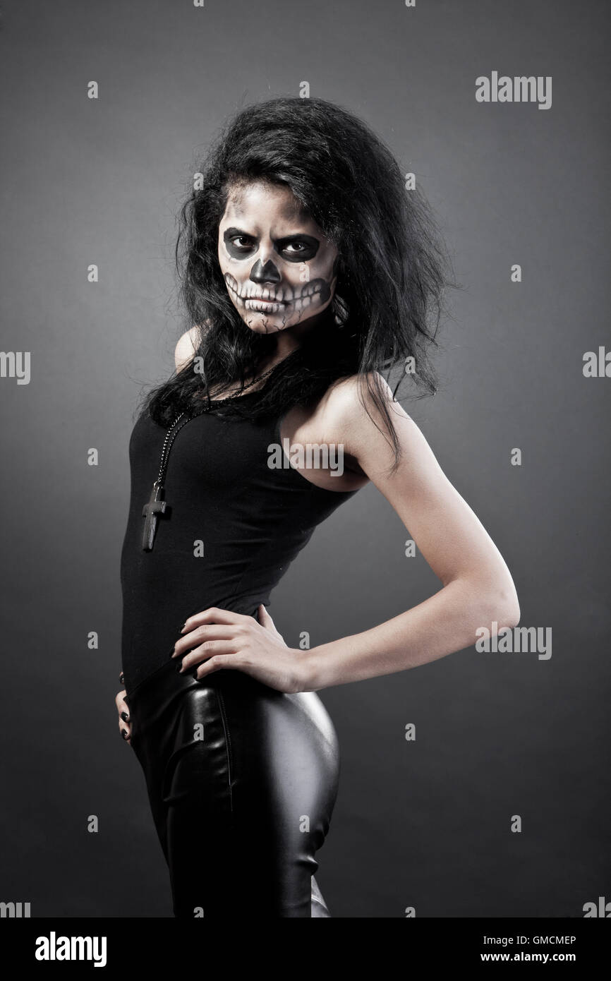 Young woman in day of the dead mask skull. Halloween face art Stock ...