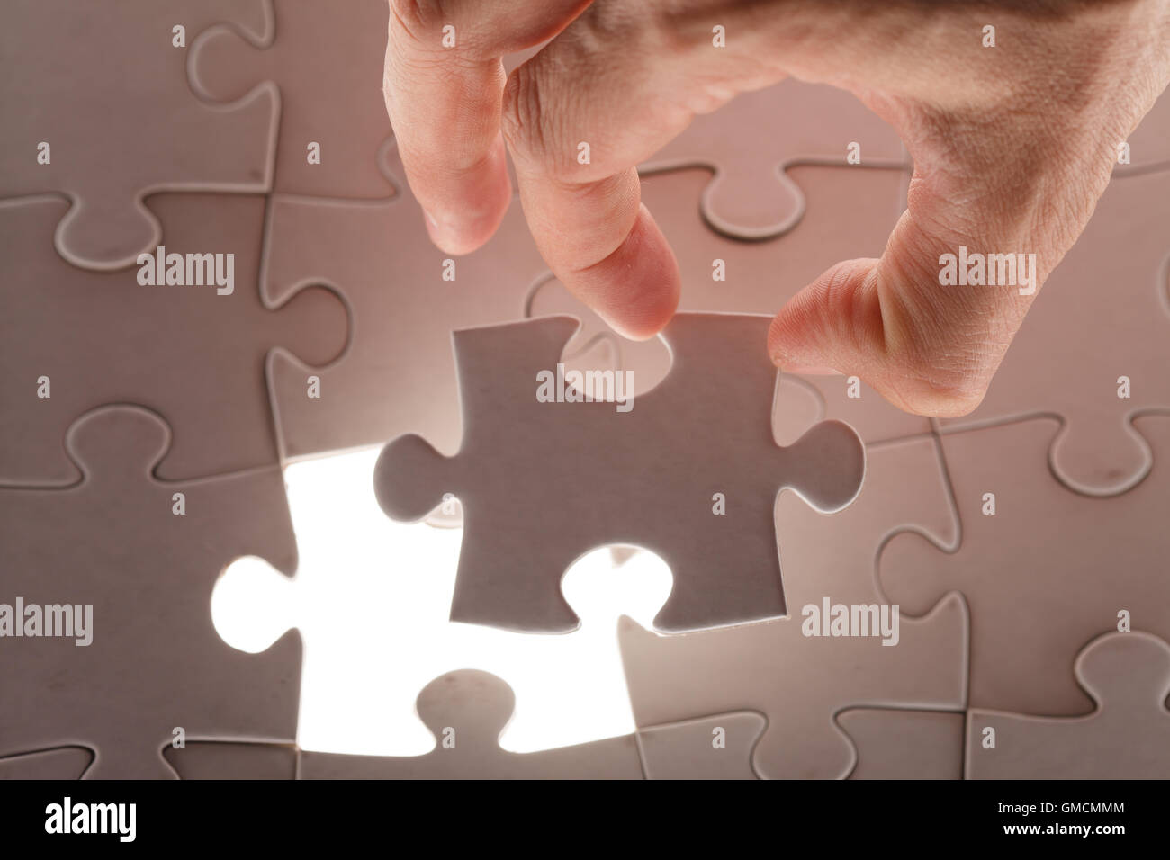 hand holding puzzle piece Stock Photo - Alamy