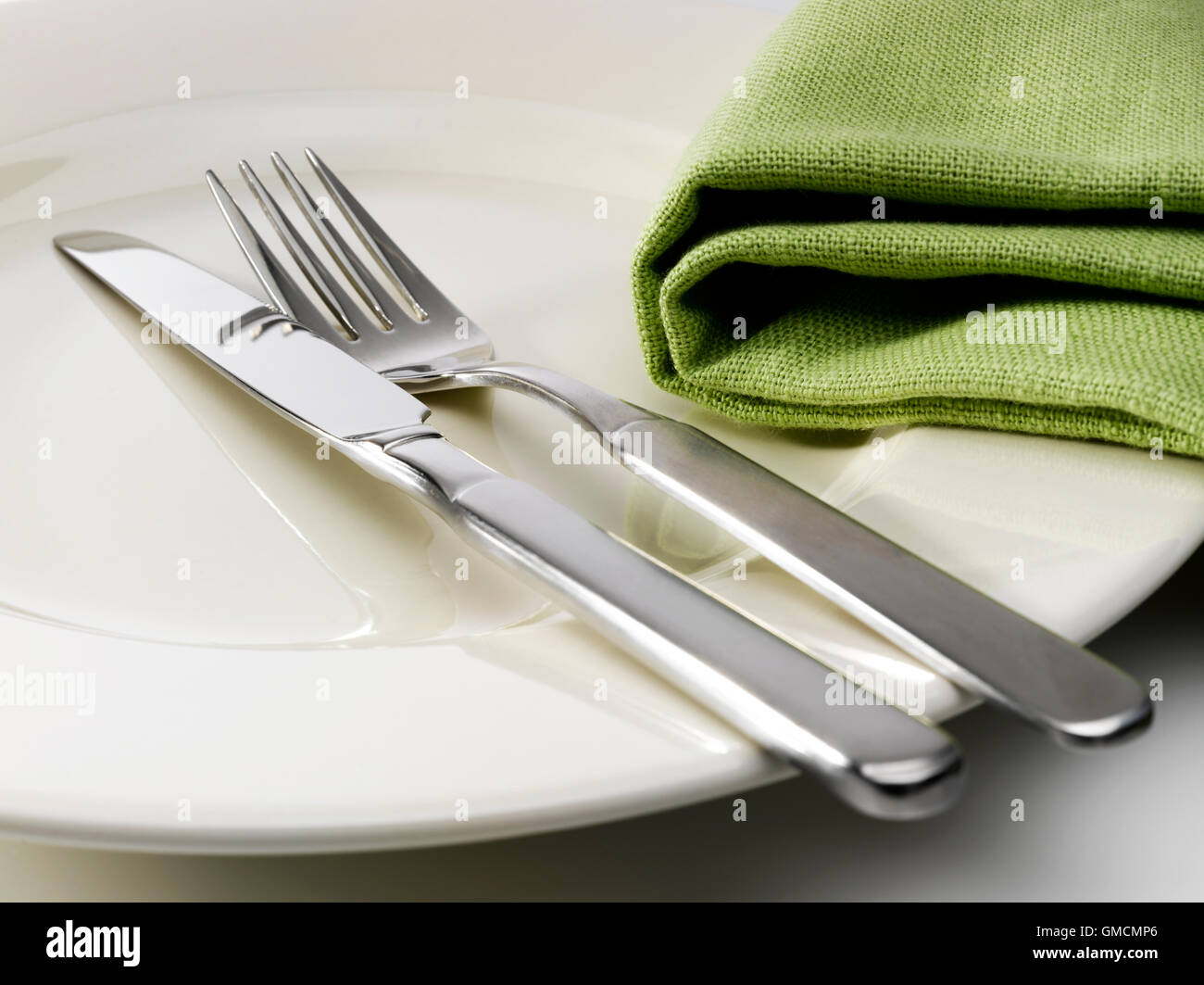 Cutlery on a plate Stock Photo - Alamy