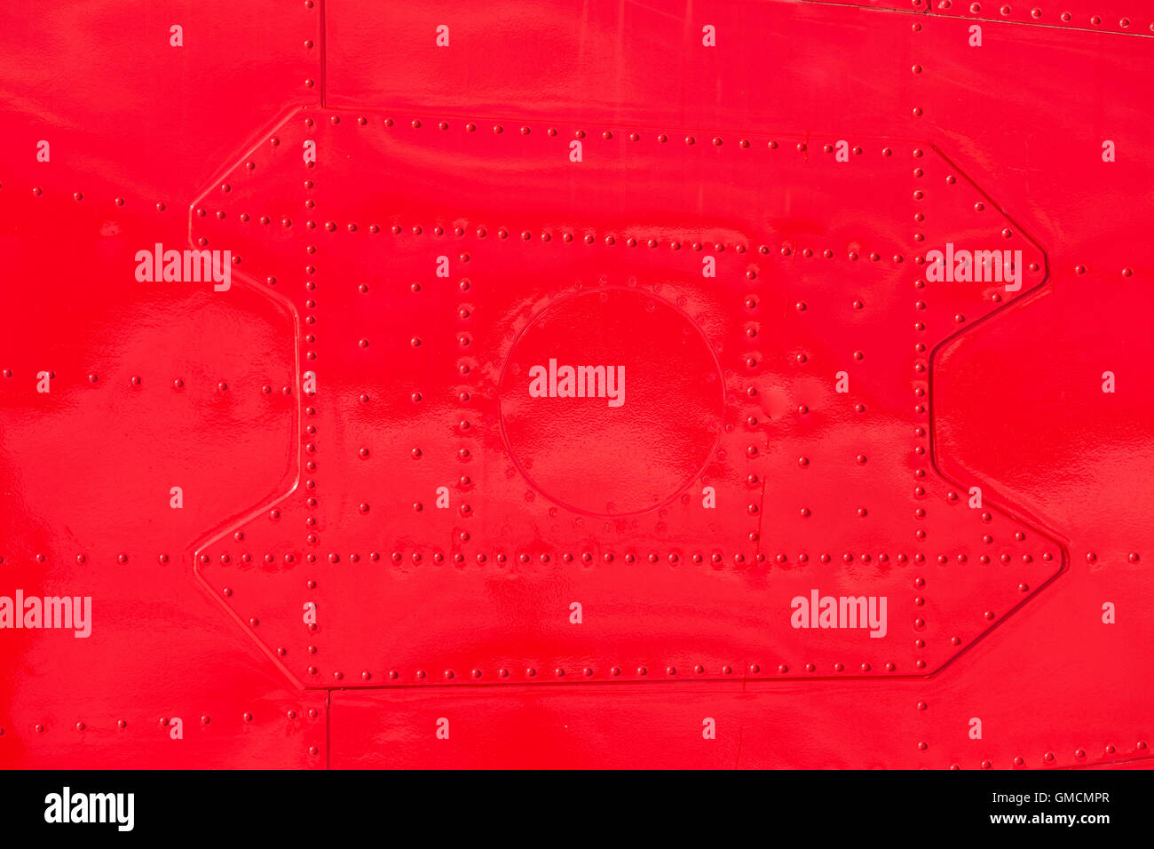 Red painted riveted metal airplane fuselage skin Stock Photo - Alamy
