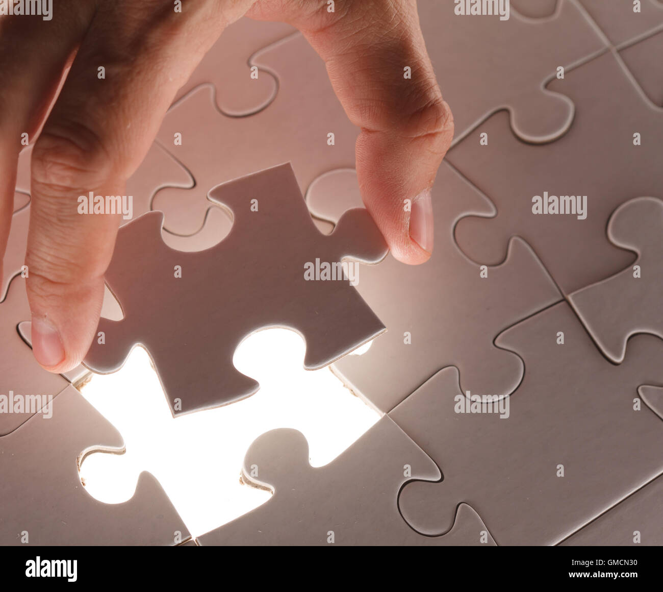 hand holding puzzle piece Stock Photo - Alamy
