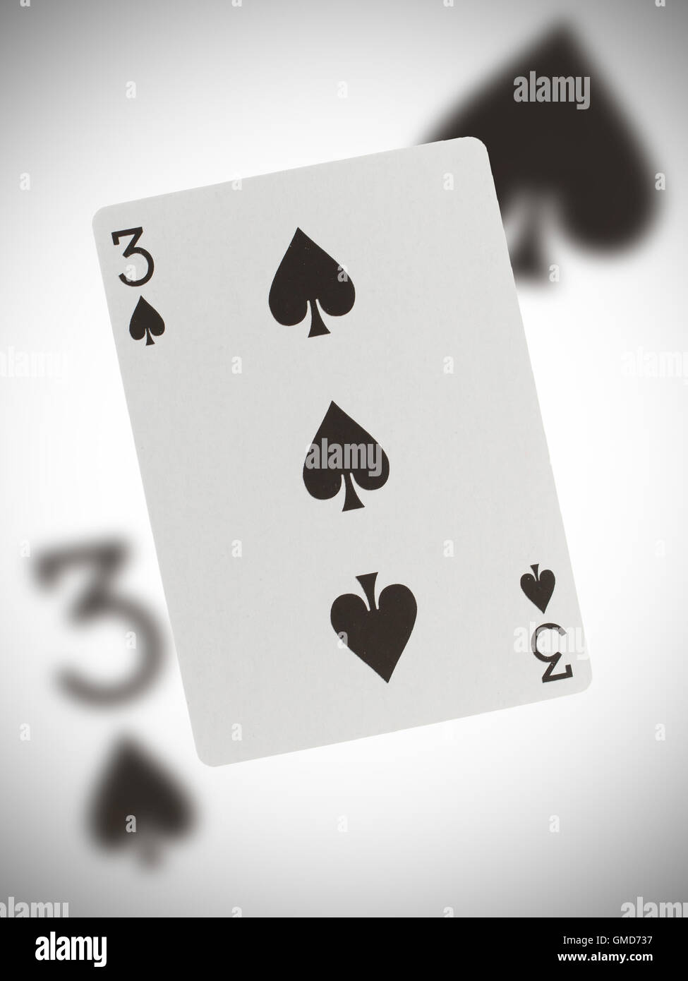 Playing card, three of spades Stock Photo - Alamy