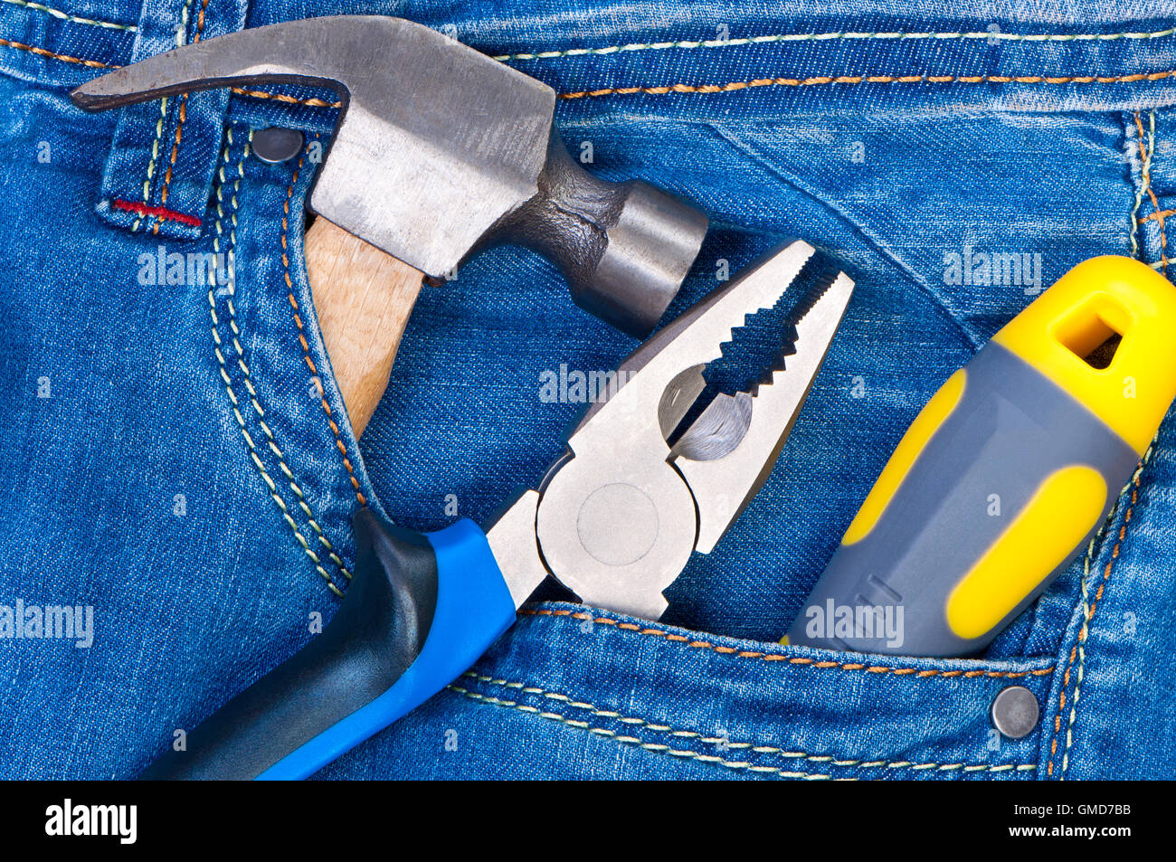 Construction tools in pocket jeans Stock Photo - Alamy