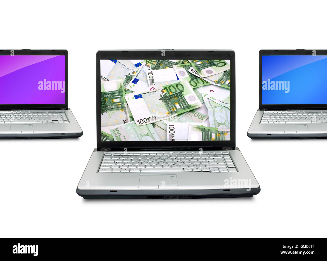Open laptops with money Stock Photo - Alamy