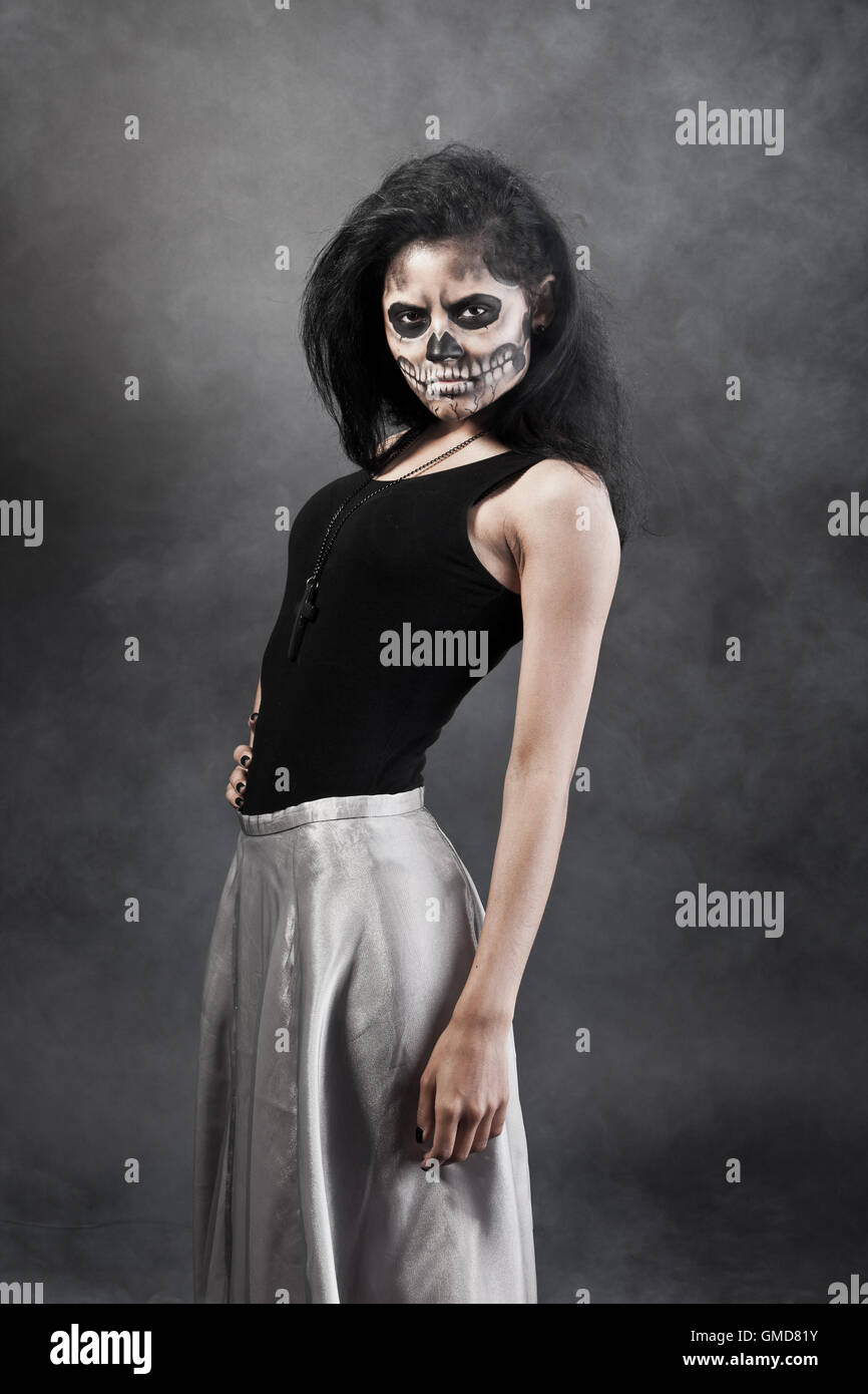 Young woman in day of the dead mask skull. Halloween face art Stock ...