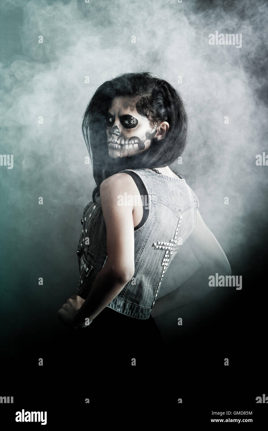 Young woman in day of the dead mask skull. Halloween face art Stock ...