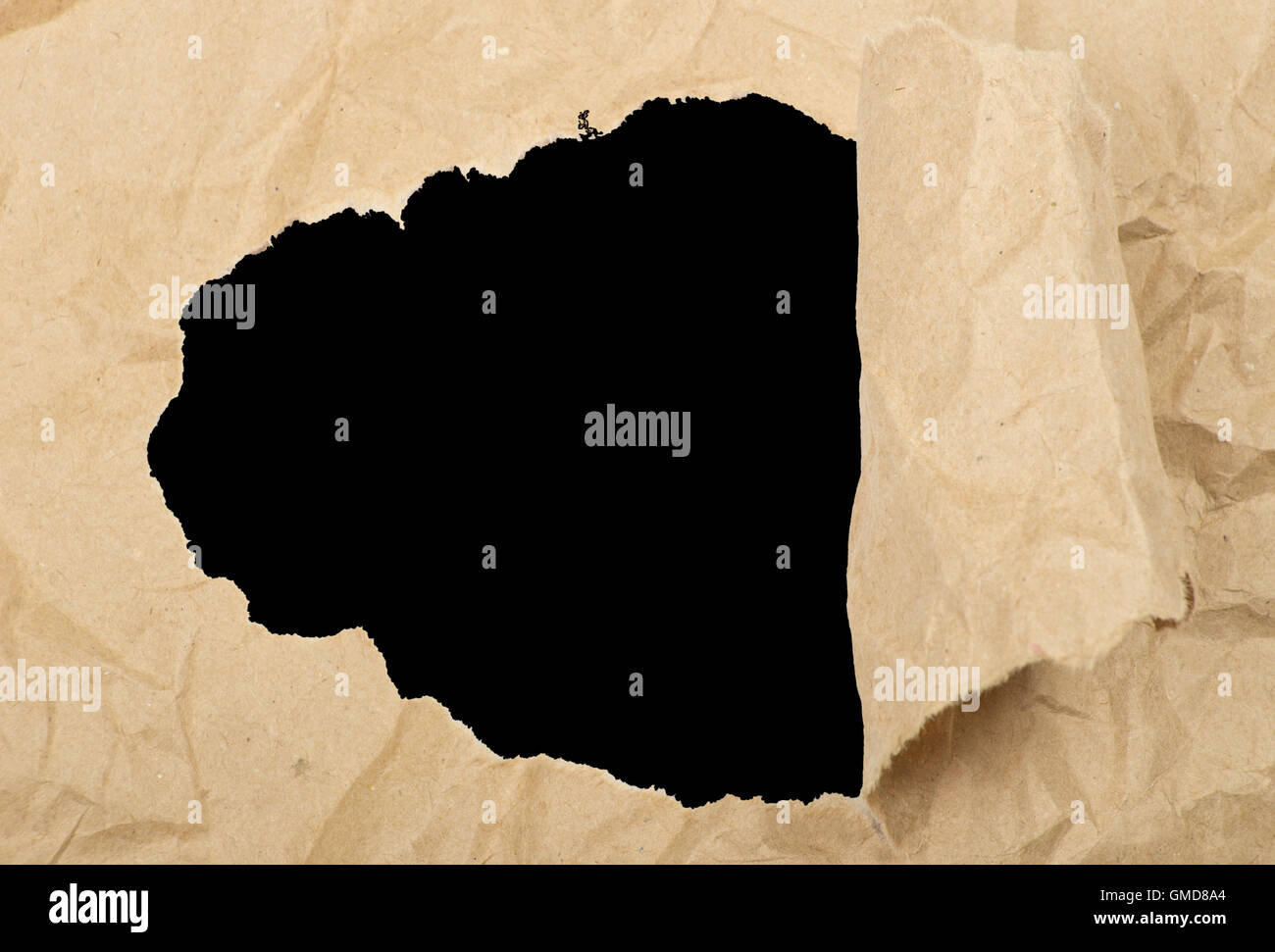 ripped white paper against a black background Stock Photo - Alamy