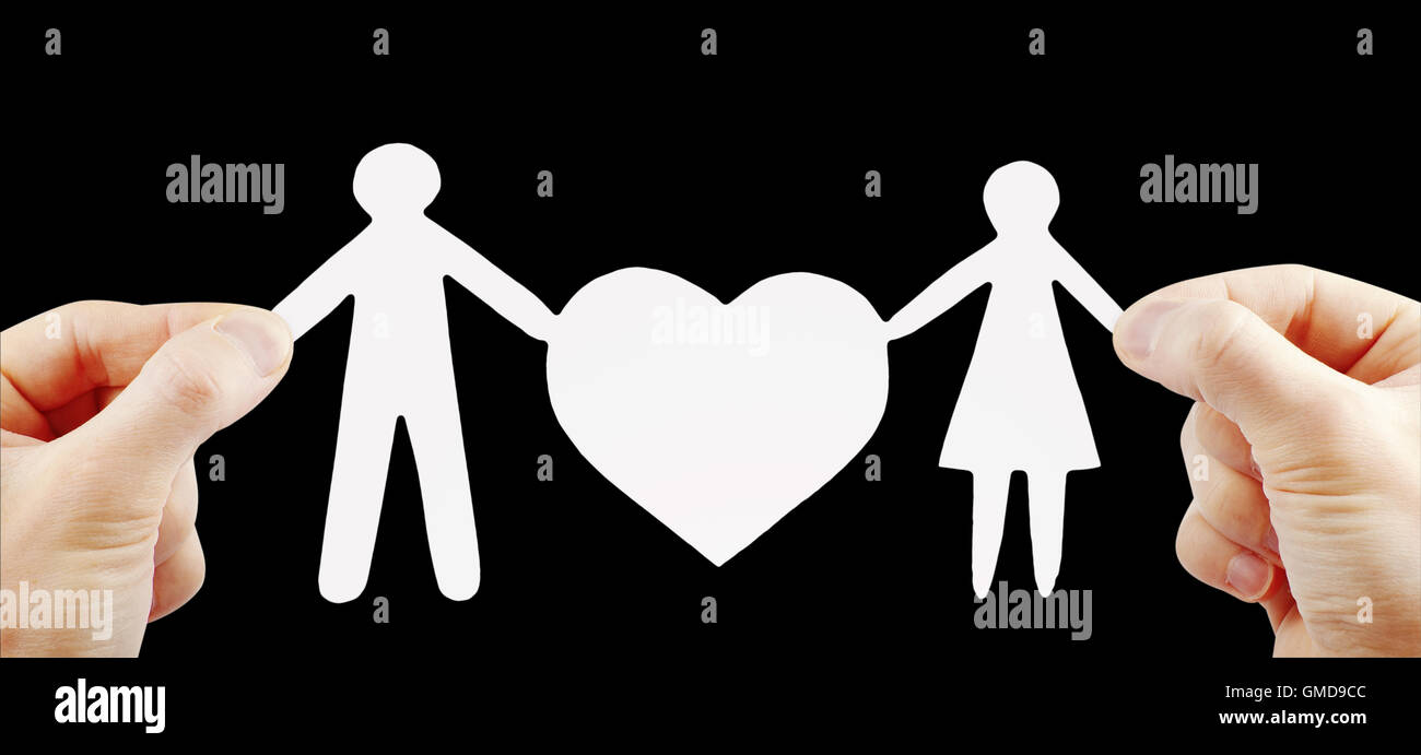 paper family with heart in hands Stock Photo - Alamy