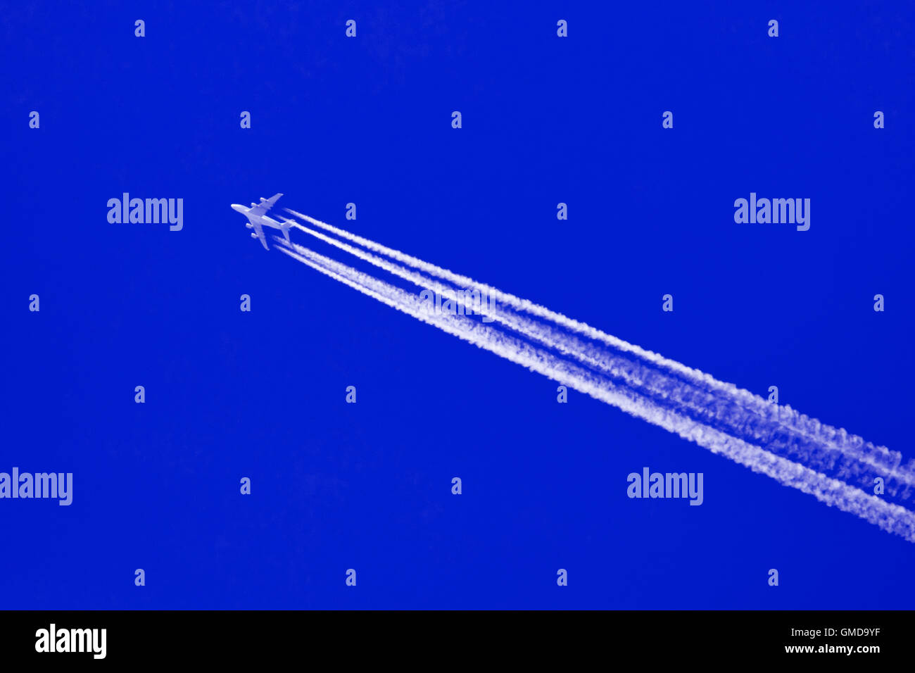 Large aircraft flying in sky, 4 stripes in the sky - Bright blue sky ...
