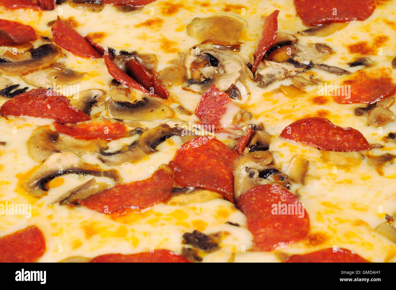 Pizza with pepperoni, background Stock Photo - Alamy
