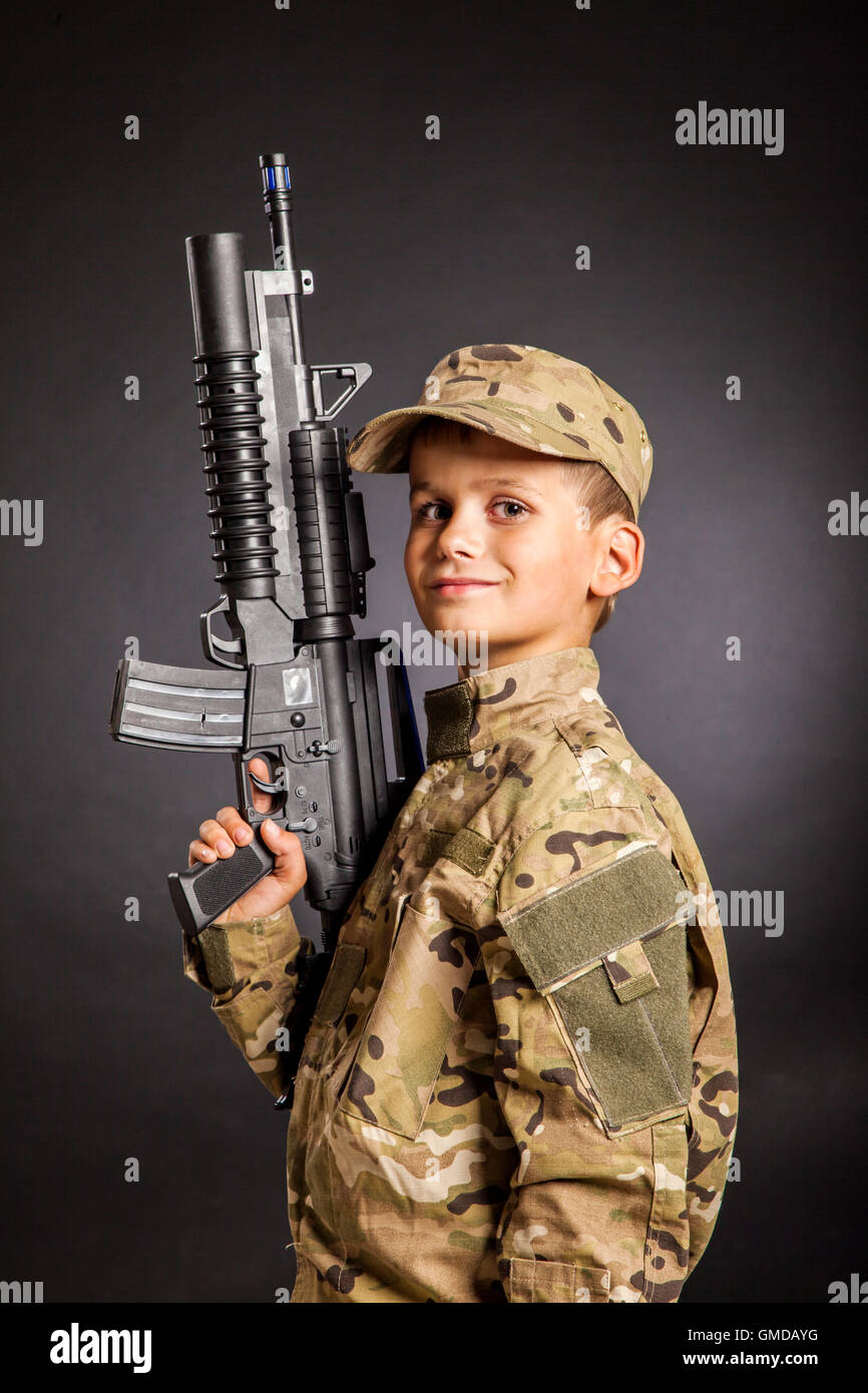 Young soldier with rifle Stock Photo - Alamy