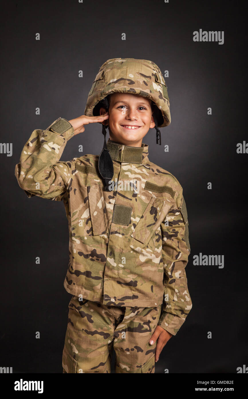 Saluting soldier. Young boy dressed like a soldier Stock Photo - Alamy