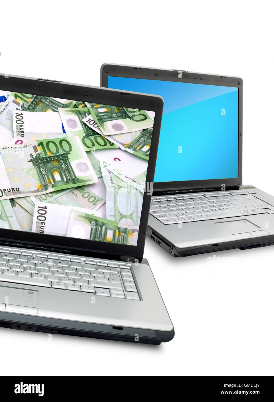 Open laptops with money Stock Photo - Alamy