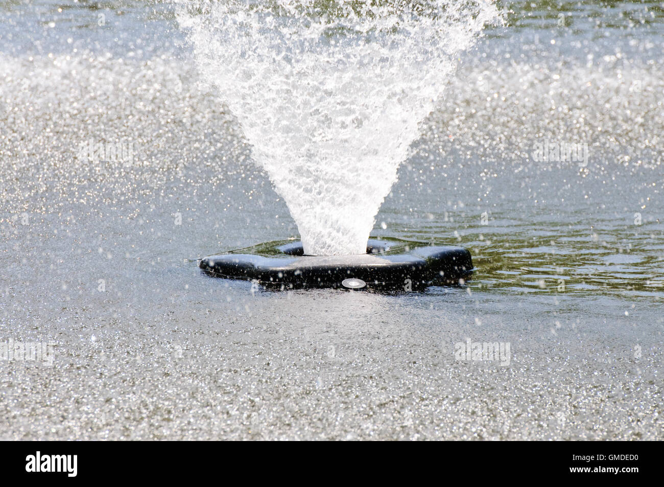 Pond fountain up close Stock Photo - Alamy