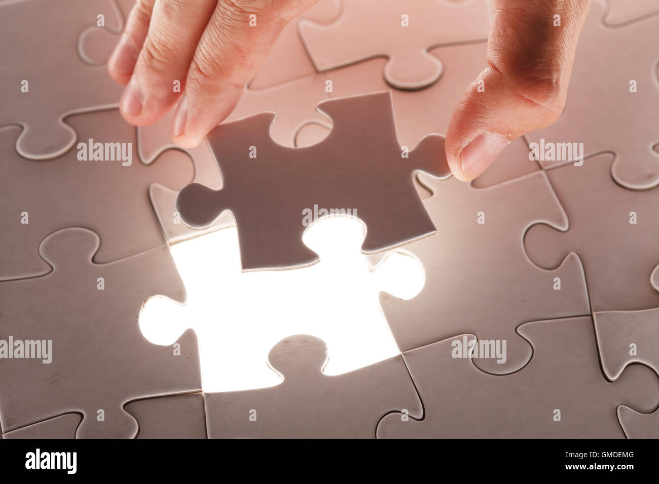 hand holding puzzle piece Stock Photo - Alamy