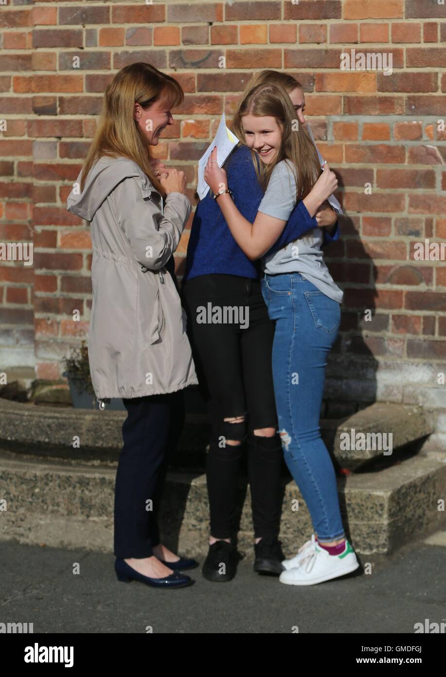 Sarah Kidd (centre) celebrates her GCSE results with her mother Fiona ...