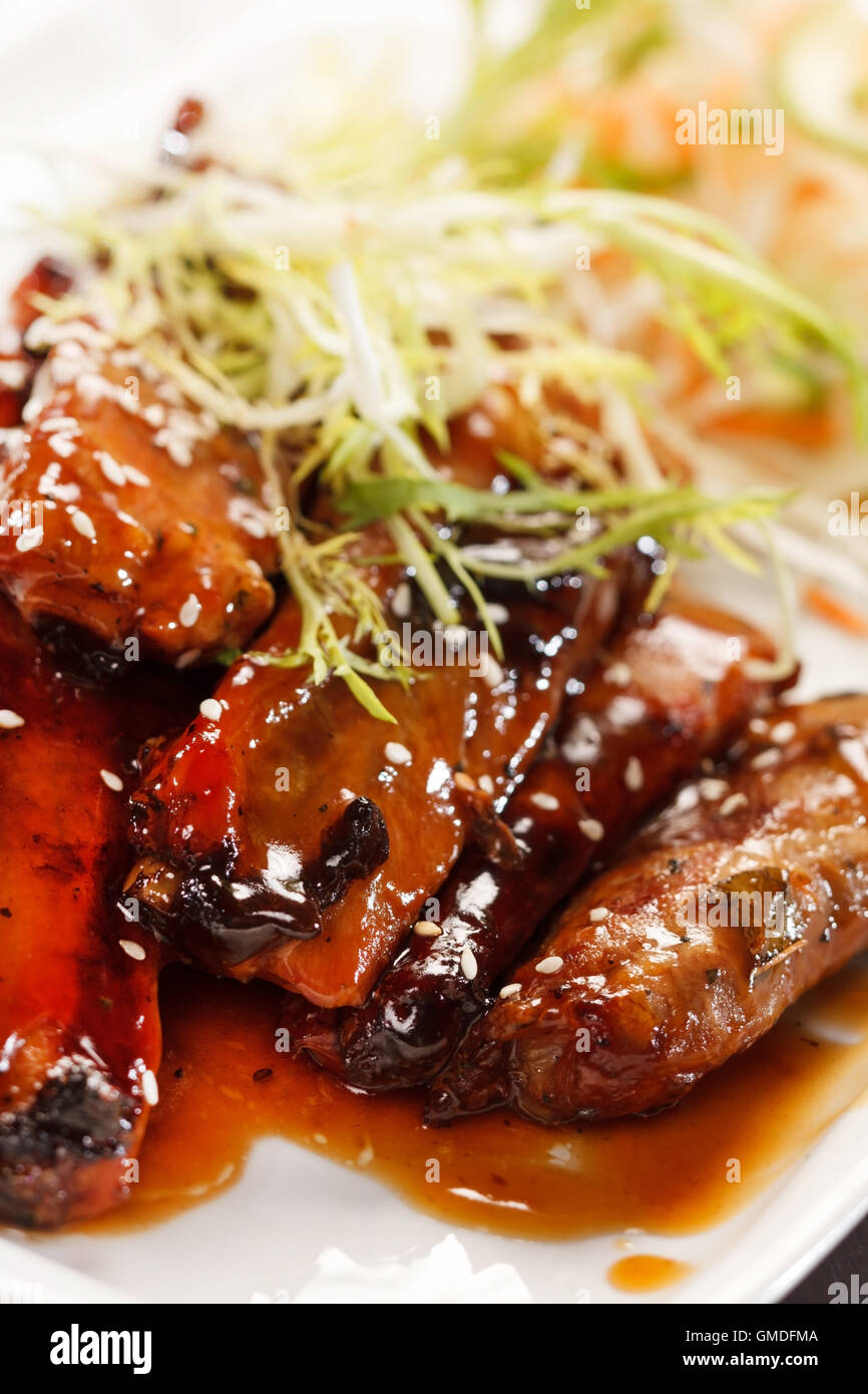 grilled ribs with salad Stock Photo - Alamy