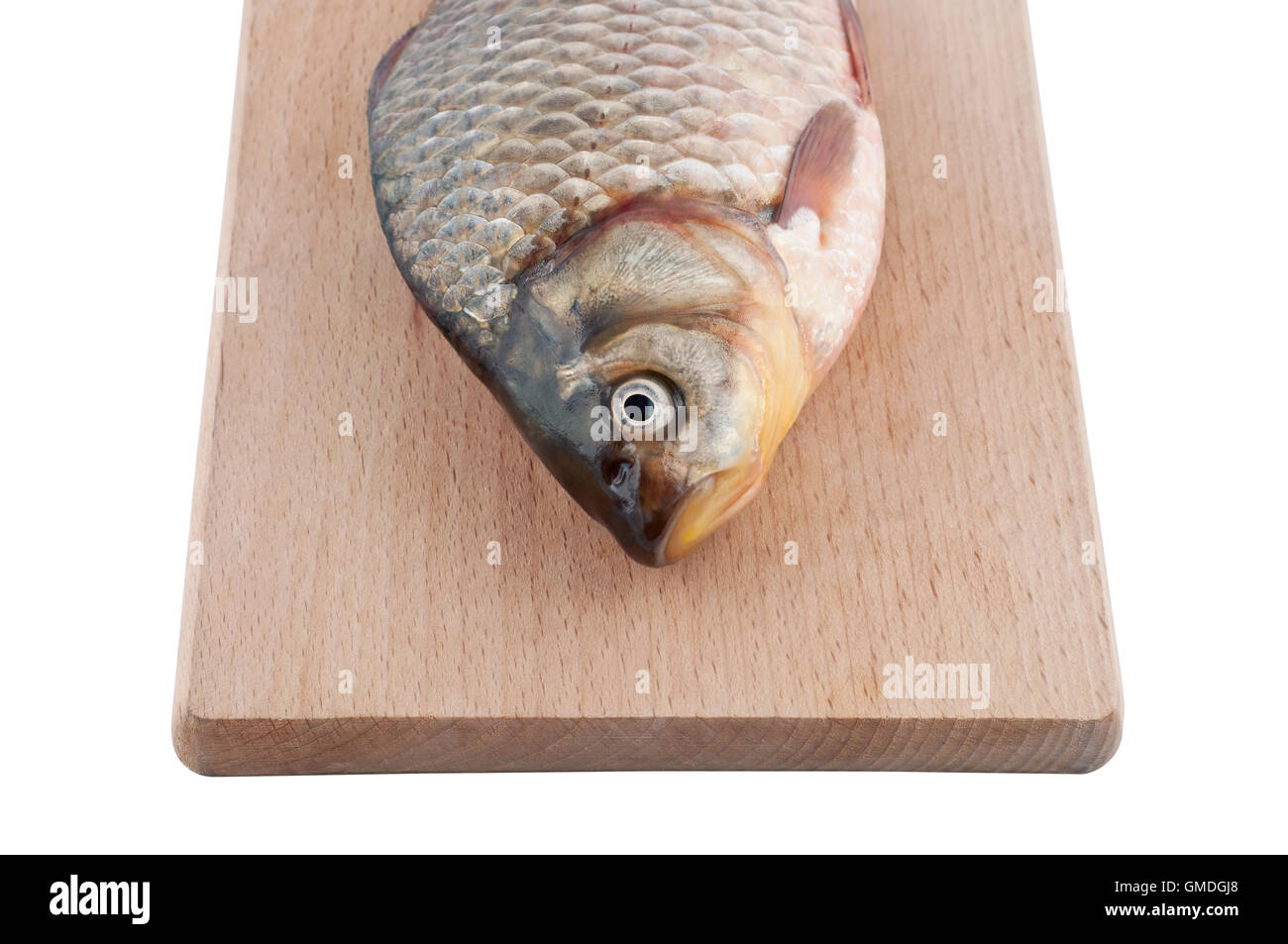 Fish on board isolated Stock Photo - Alamy