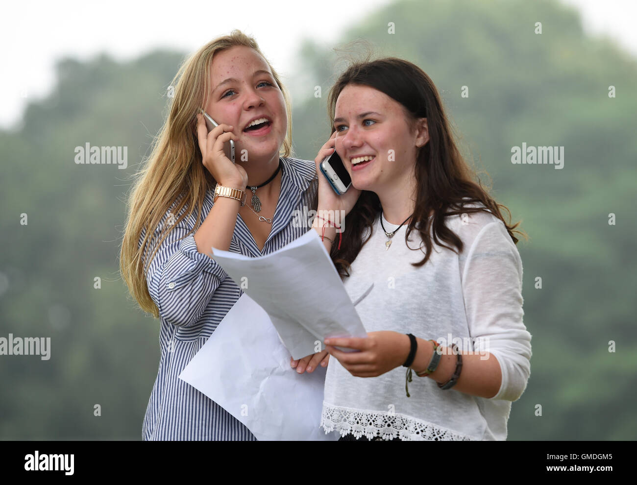 Chloe Mellor (left) and Florence Cutts speak on their phones after ...