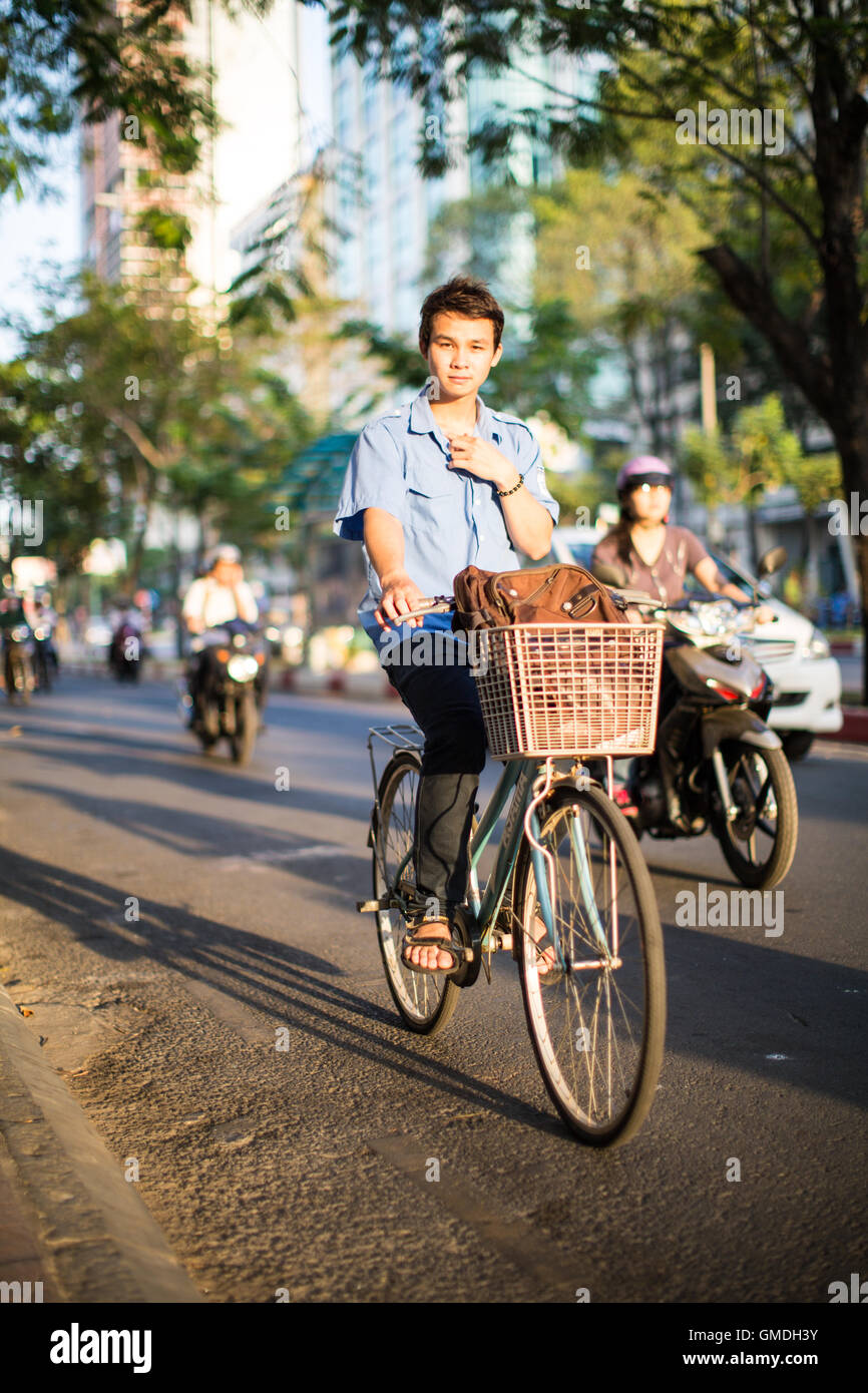 Vietnamese handsome boy riding bicycle in the street Stock Photo - Alamy