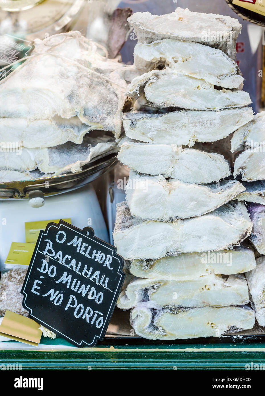 Storefront with dried and salted cod in Porto, Portugal, with a placard ...