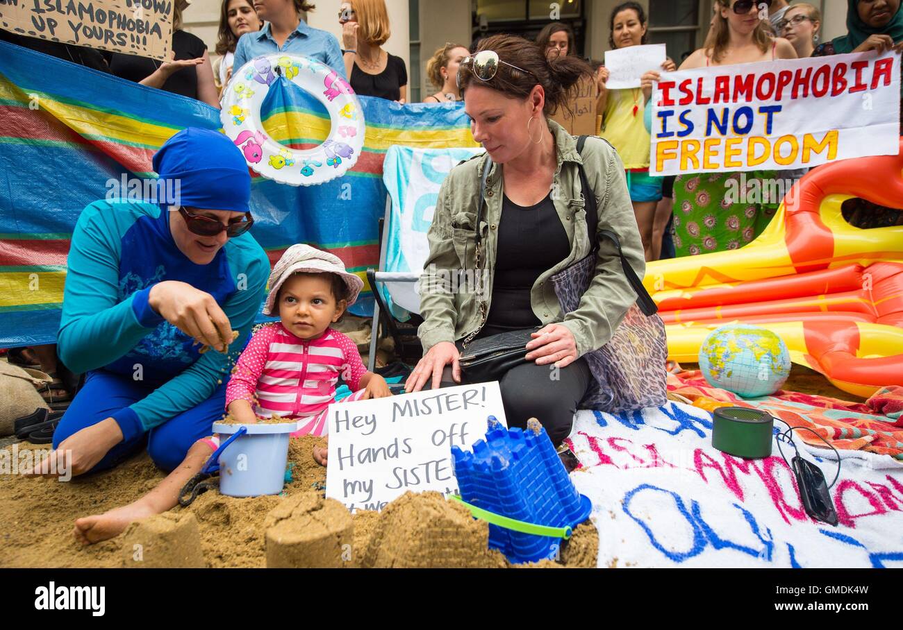 Demonstrators stage a beach party outside the French Embassy, in ...