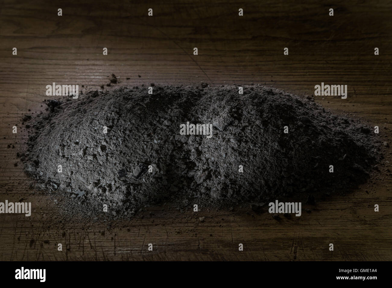 A pile of ash from a wood fire on a wooden bench Stock Photo - Alamy