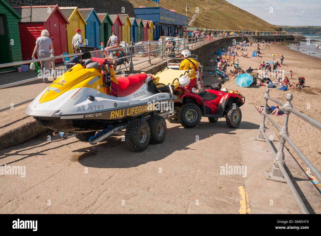 RNLI lifeguard get his jet ski into position on the slipway at Whitby ...