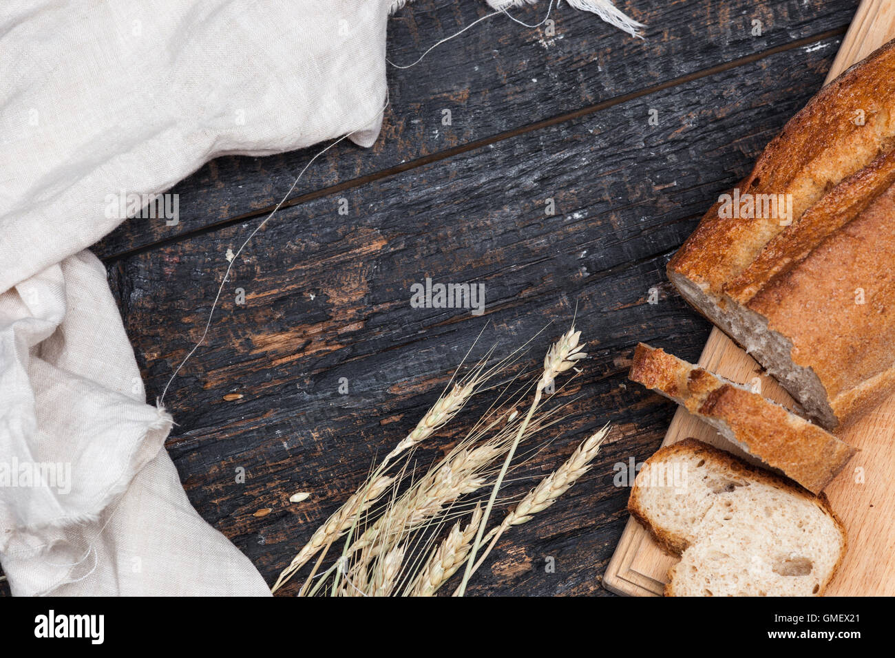 Rustic bread on wood table. Dark woody background with free text space ...