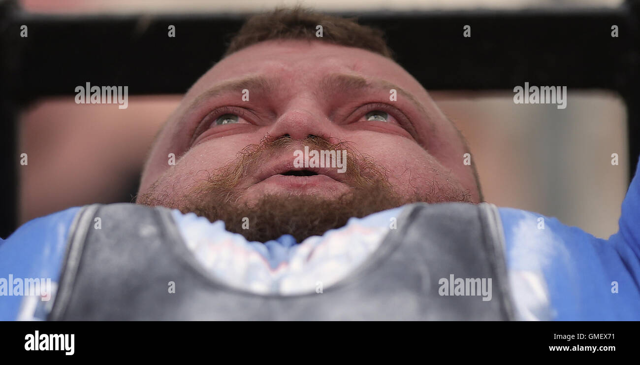 Ed Hall from England lifts a log during the UK Strongest Man 2016 heats ...