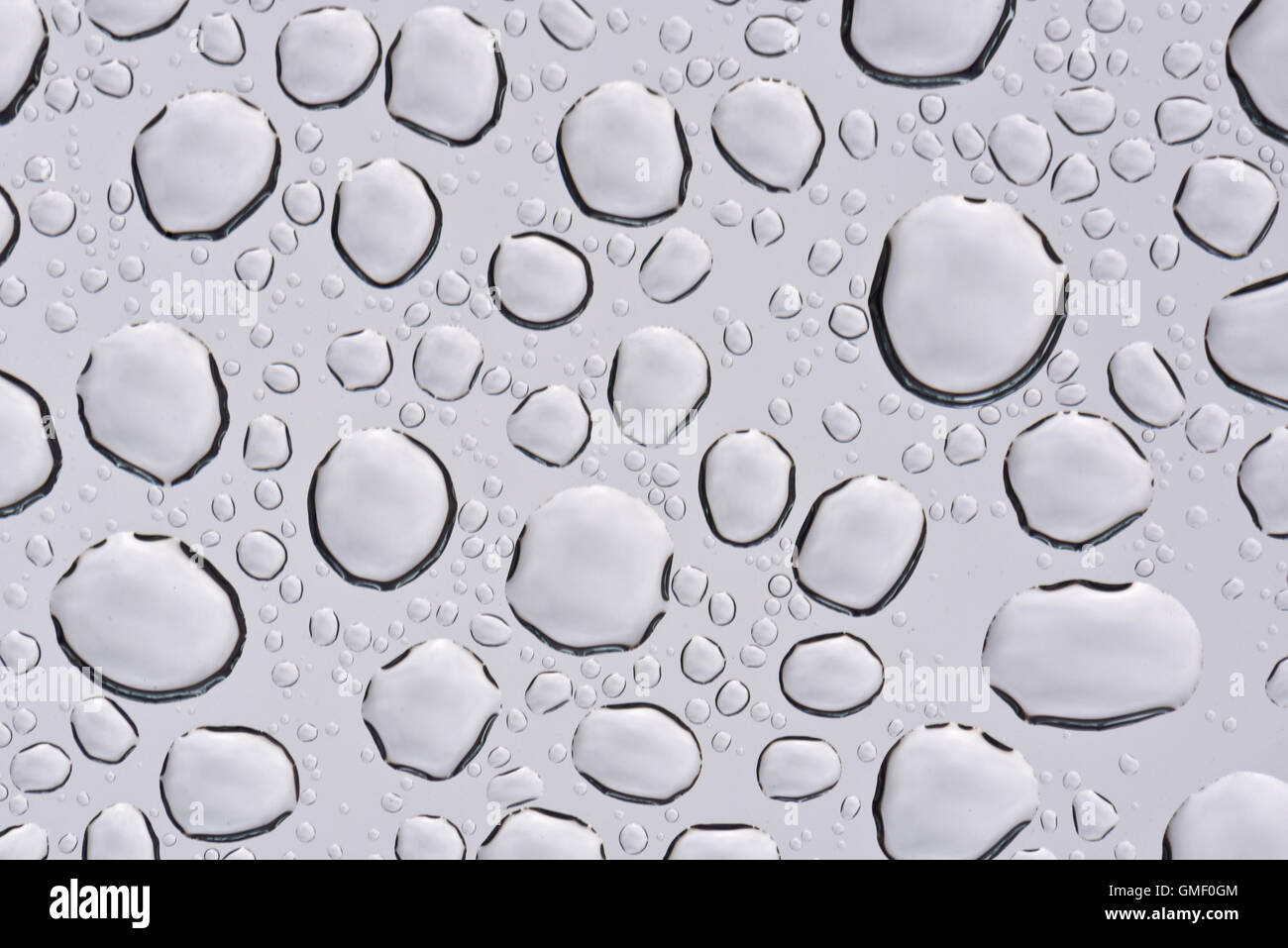Back lit water droplets on a dormer window Stock Photo - Alamy
