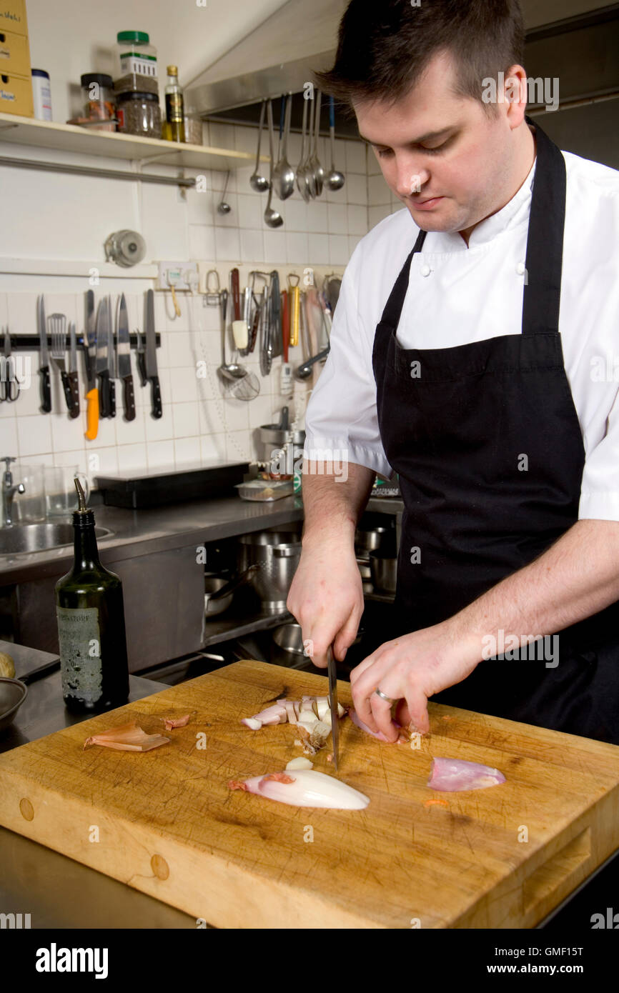 Professional chef at work in a restaurant kitchen Stock Photo - Alamy