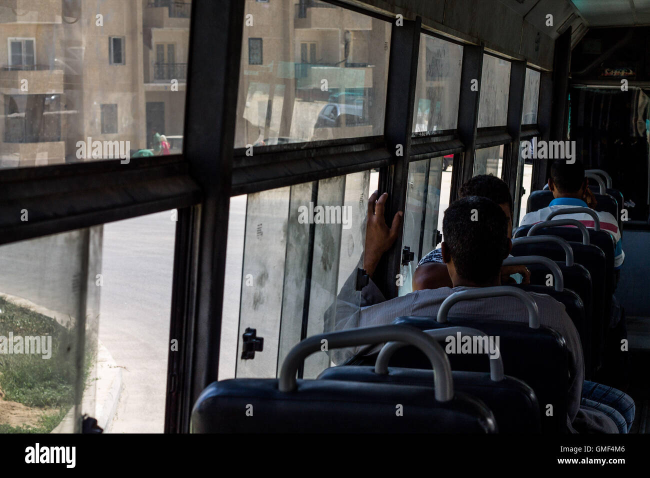 Egypt. 25th Aug, 2016. A man riding a public transport bus in Giza ...
