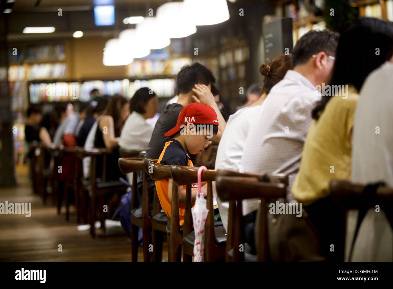 Seoul, South Korea. 20th Aug, 2016. A little boy sitting among the ...