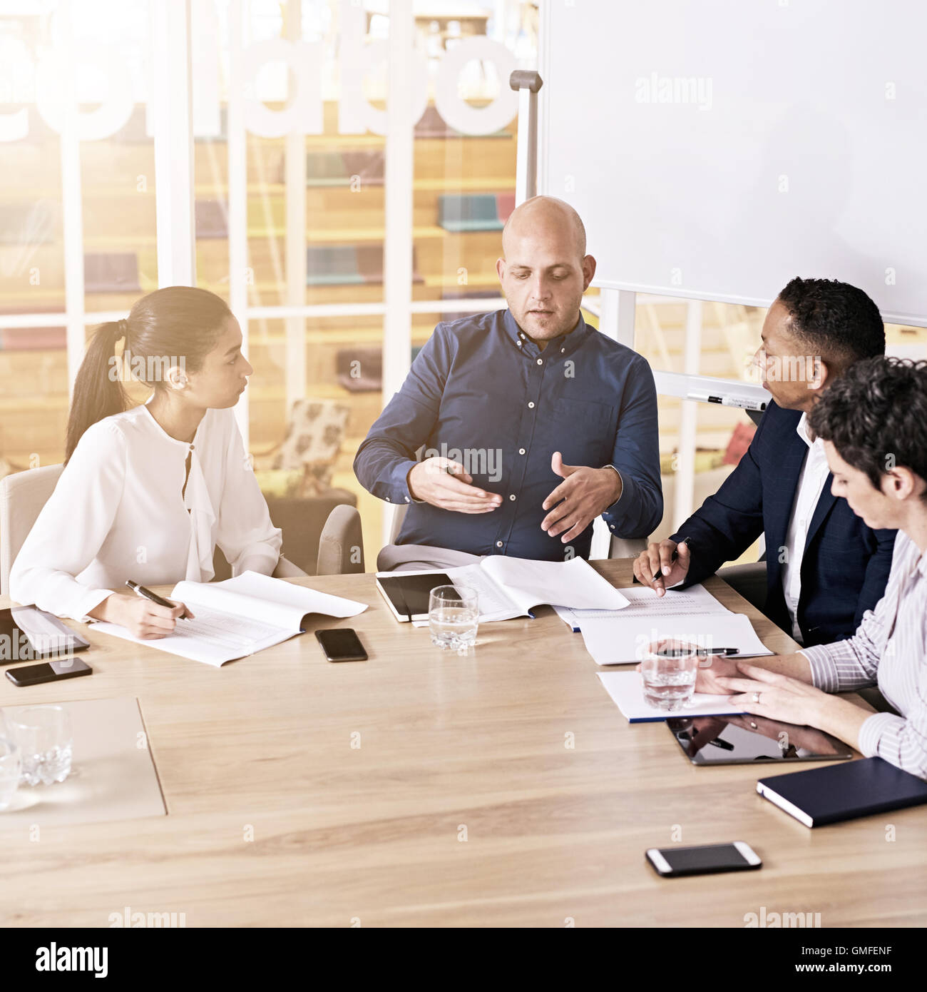 Marketing manager making a proposition to his new production team Stock ...