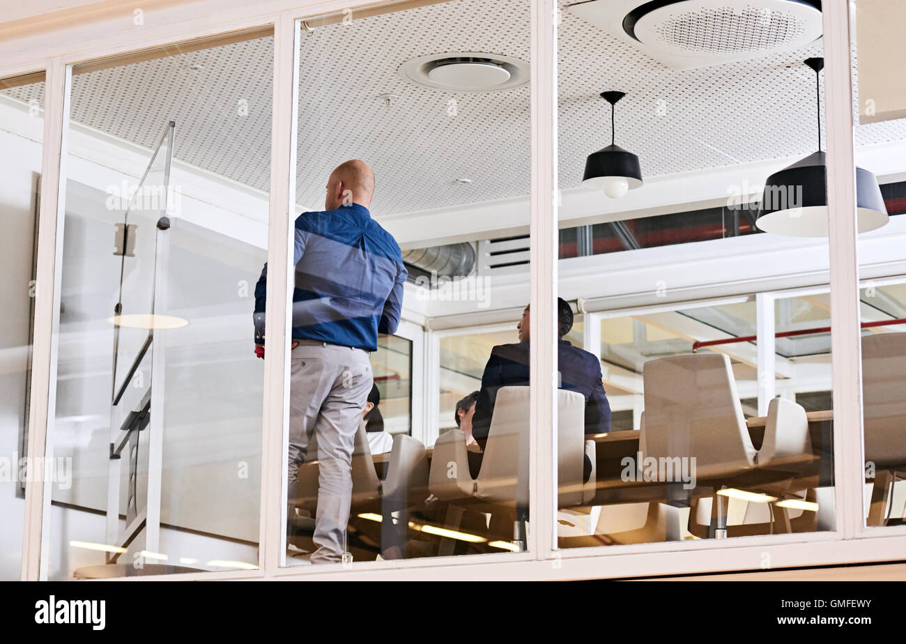 modern conference room from outside with meeting taking place inside ...