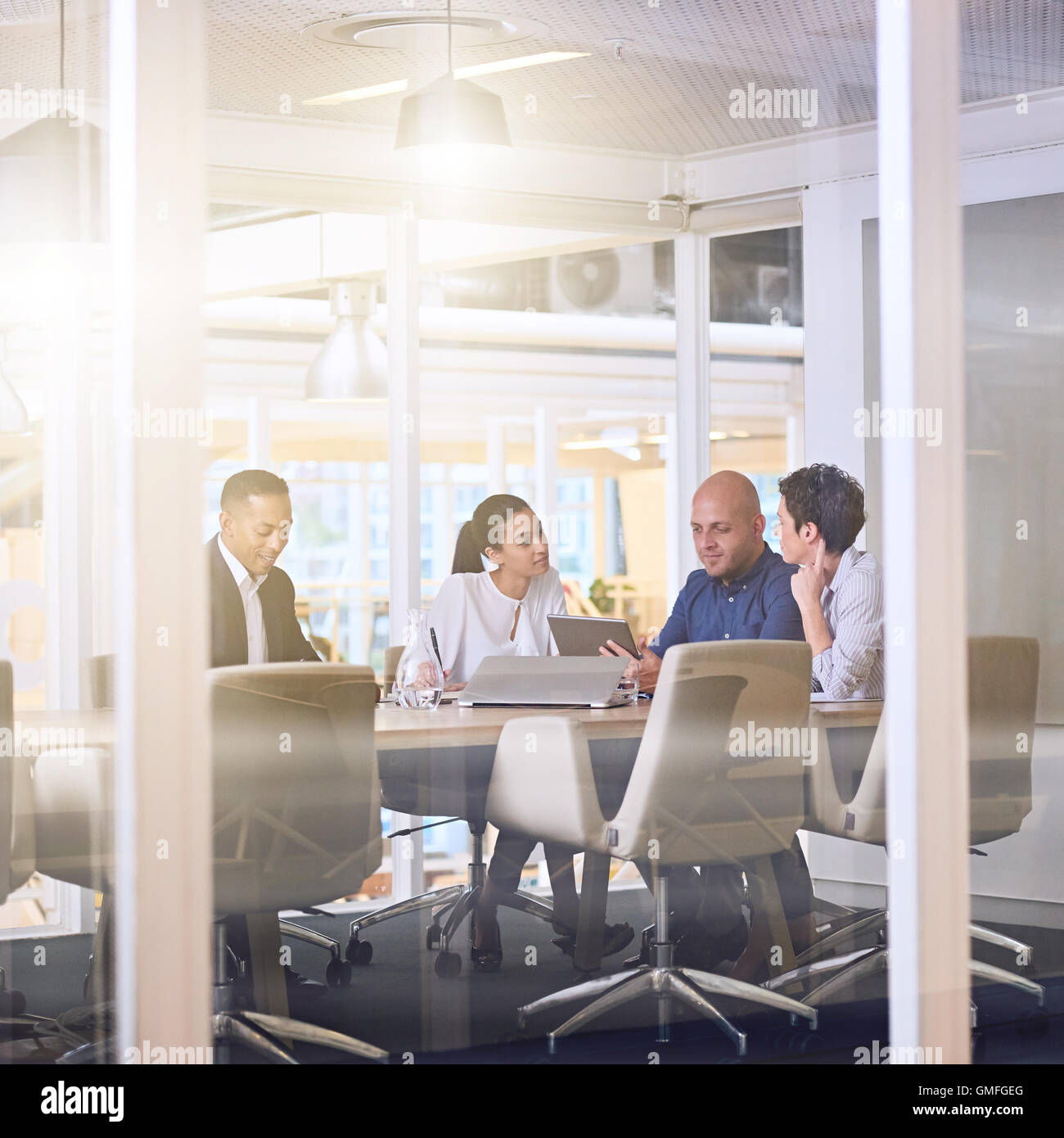 early morning sunrise business meeting in modern office conference room ...