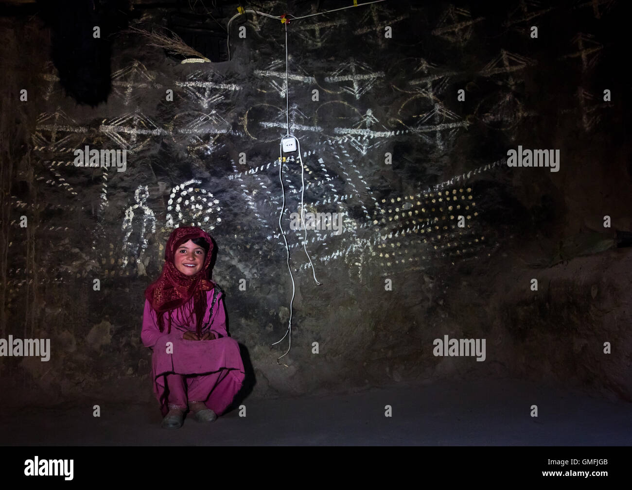 Afghan girl inside a traditional pamiri house decorated for nowruz ...