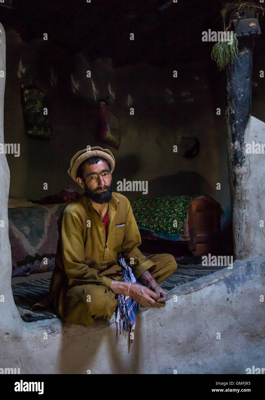 Afghan man inside his traditional pamiri house, Badakhshan province ...