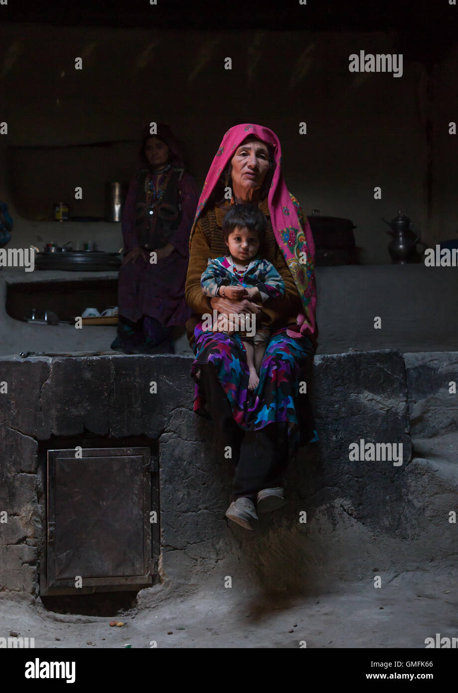 Afghan mother and her daughter inside their traditional pamiri house ...