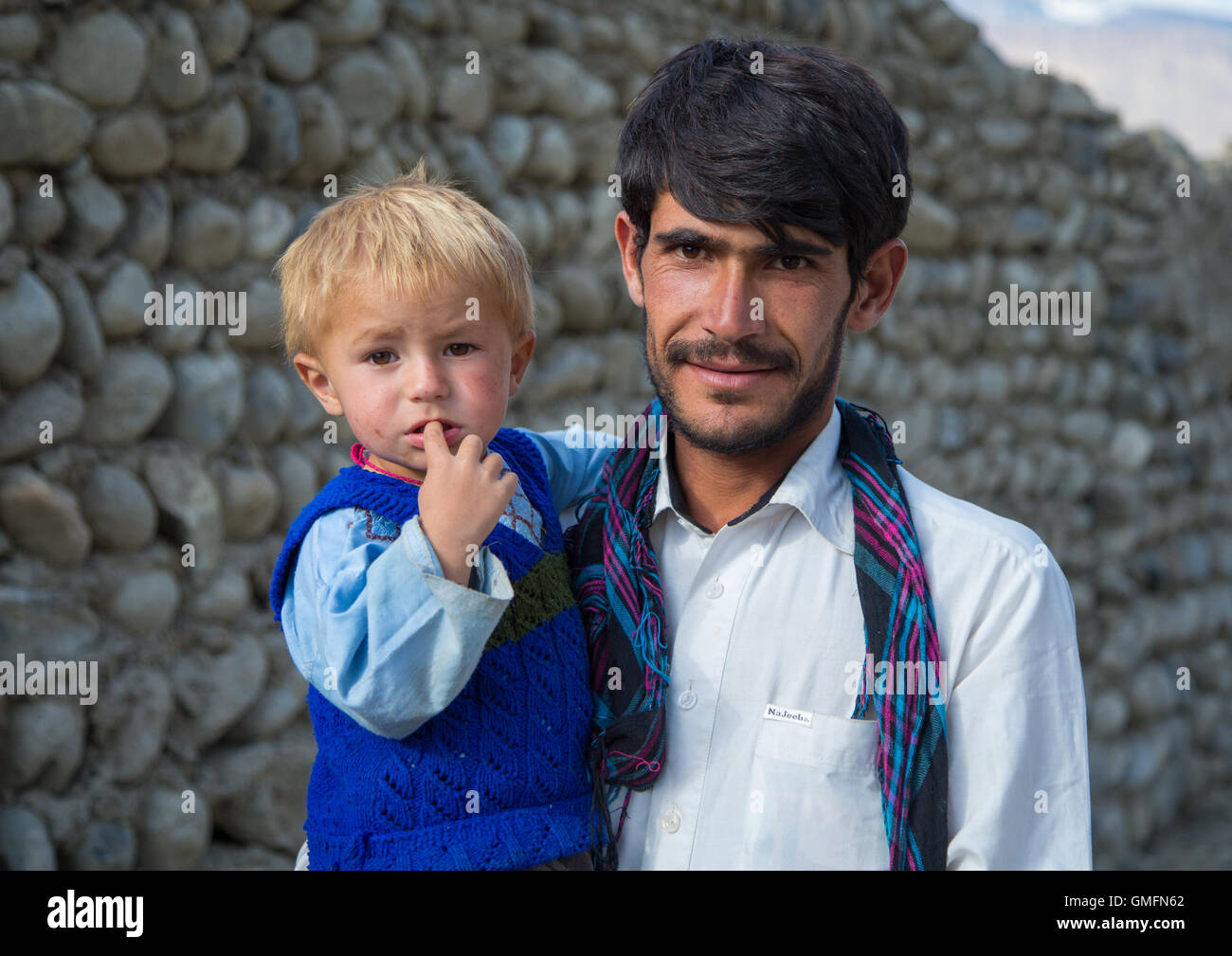 Portrait of an afghan boy with blonde hair with his father, Badakhshan ...