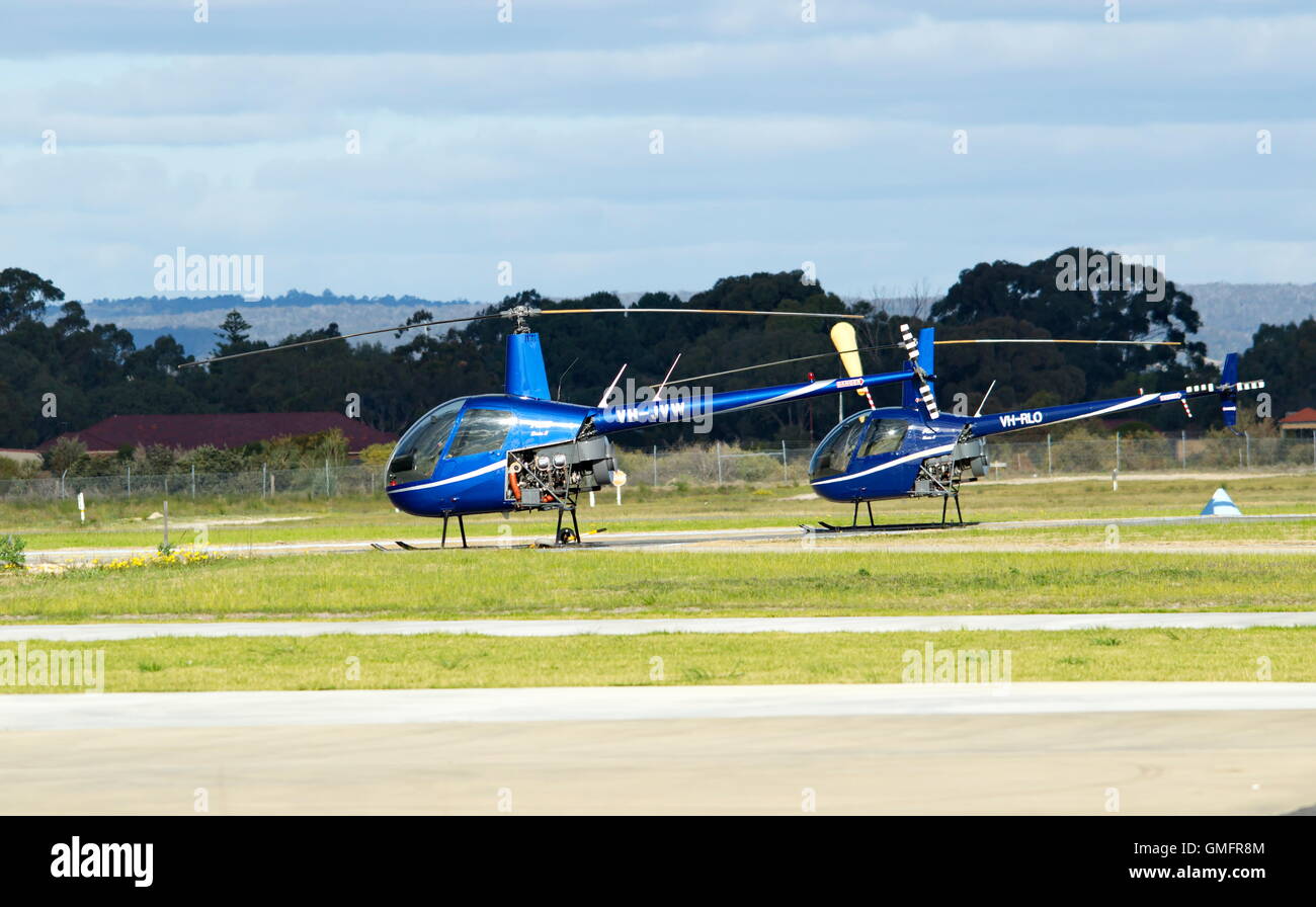 Two Blue Helicopters on the Heli pad Stock Photo - Alamy