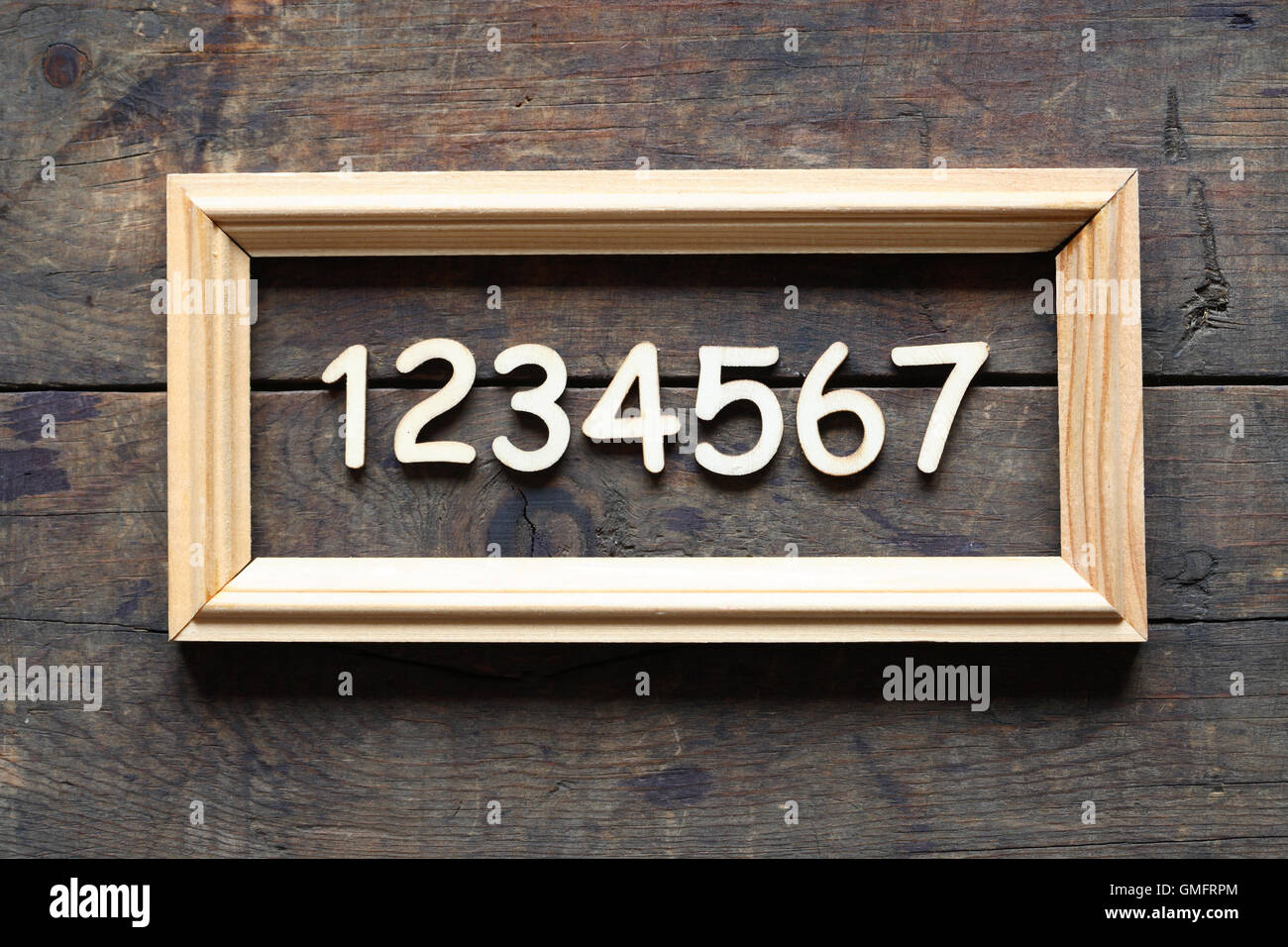 Set of wooden digits inside picture frame on wood background Stock ...