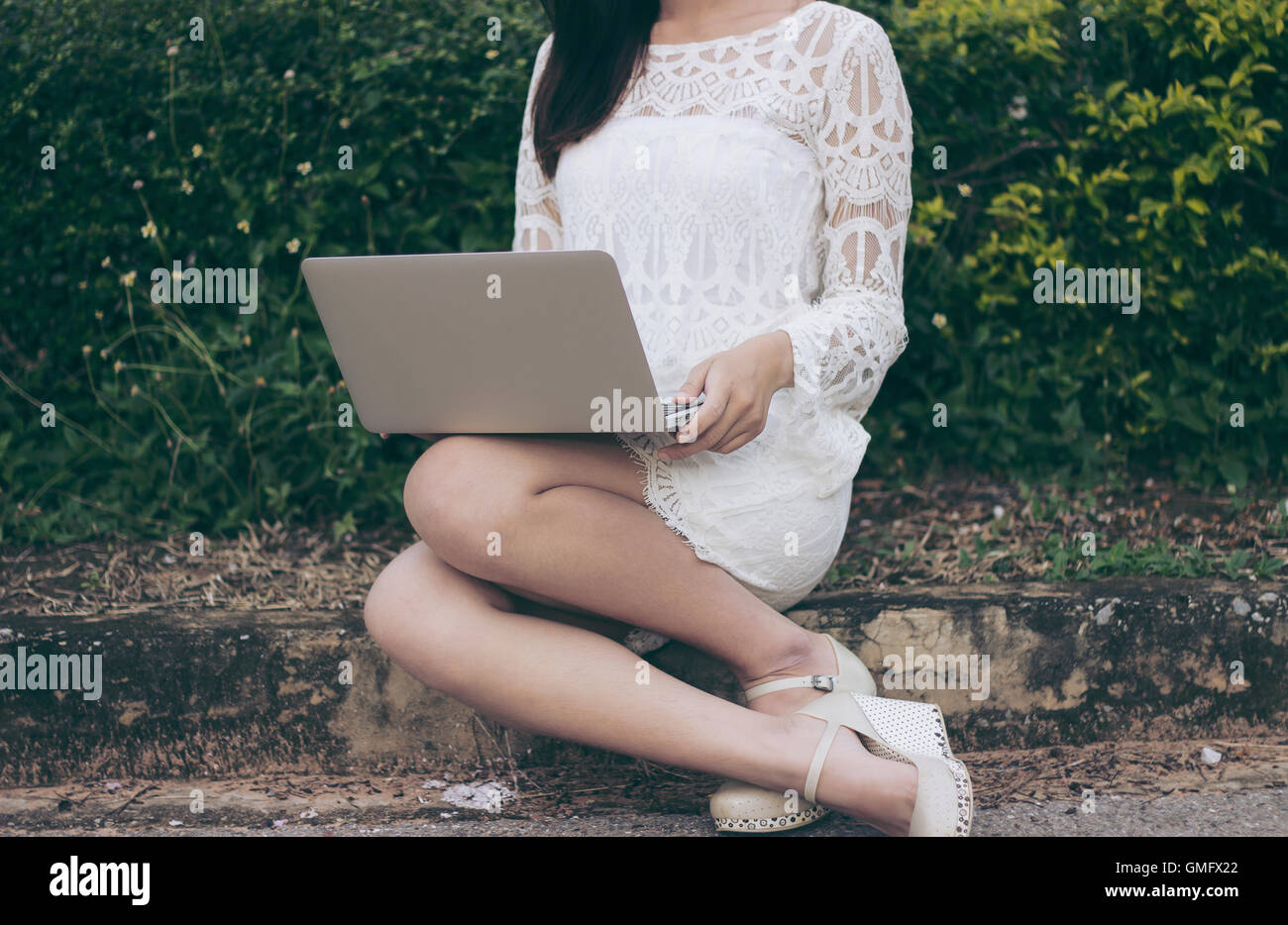 lady use to laptop in garden Stock Photo - Alamy