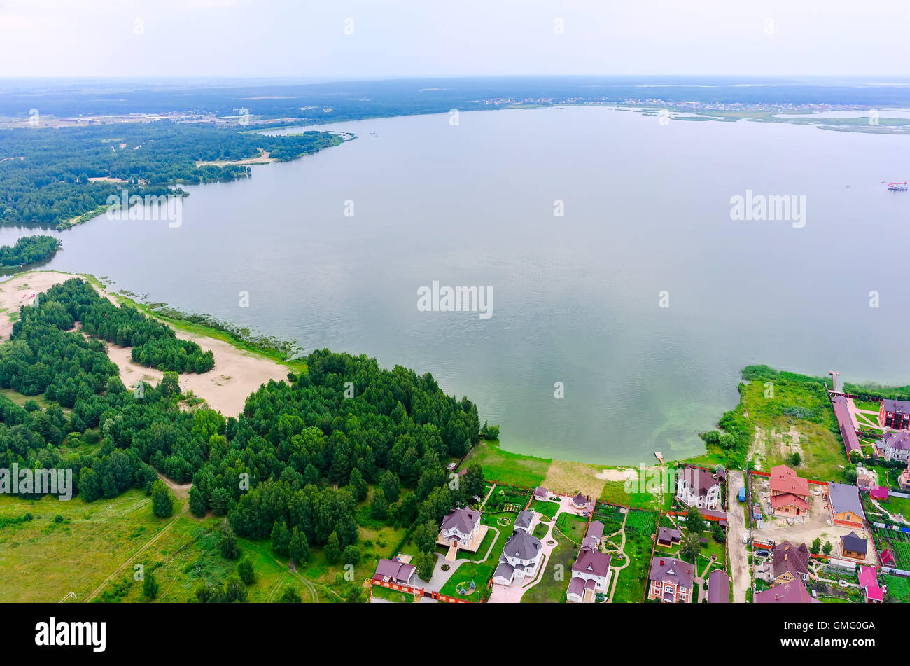 Private houses on bank of lake Stock Photo - Alamy