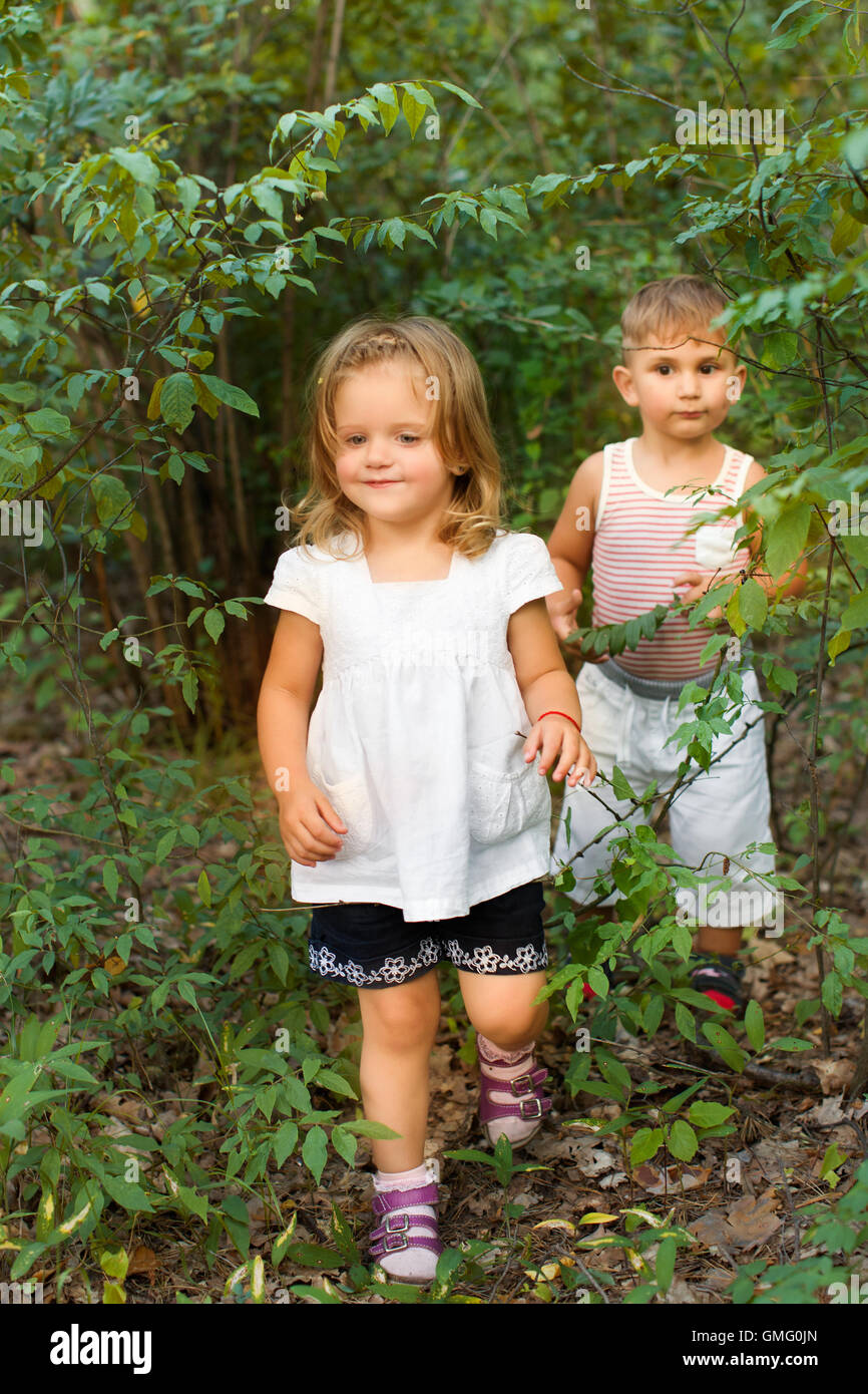 Children playing in the woods hi-res stock photography and images - Alamy