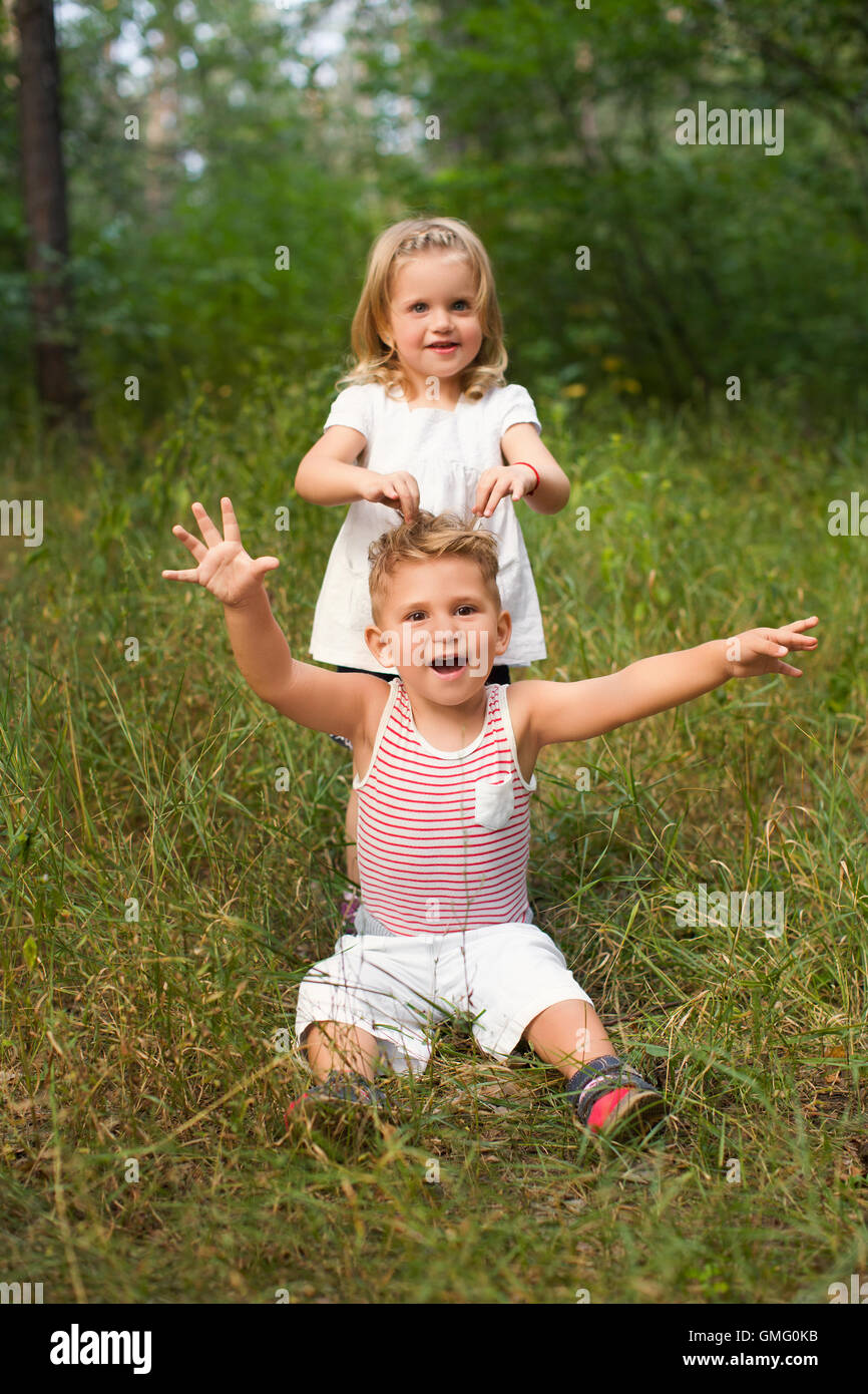 Children playing in the woods Stock Photo - Alamy